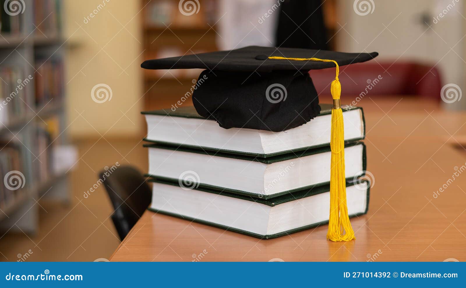 Graduation Cap on a Stack of Books in the Library. Stock Photo - Image ...