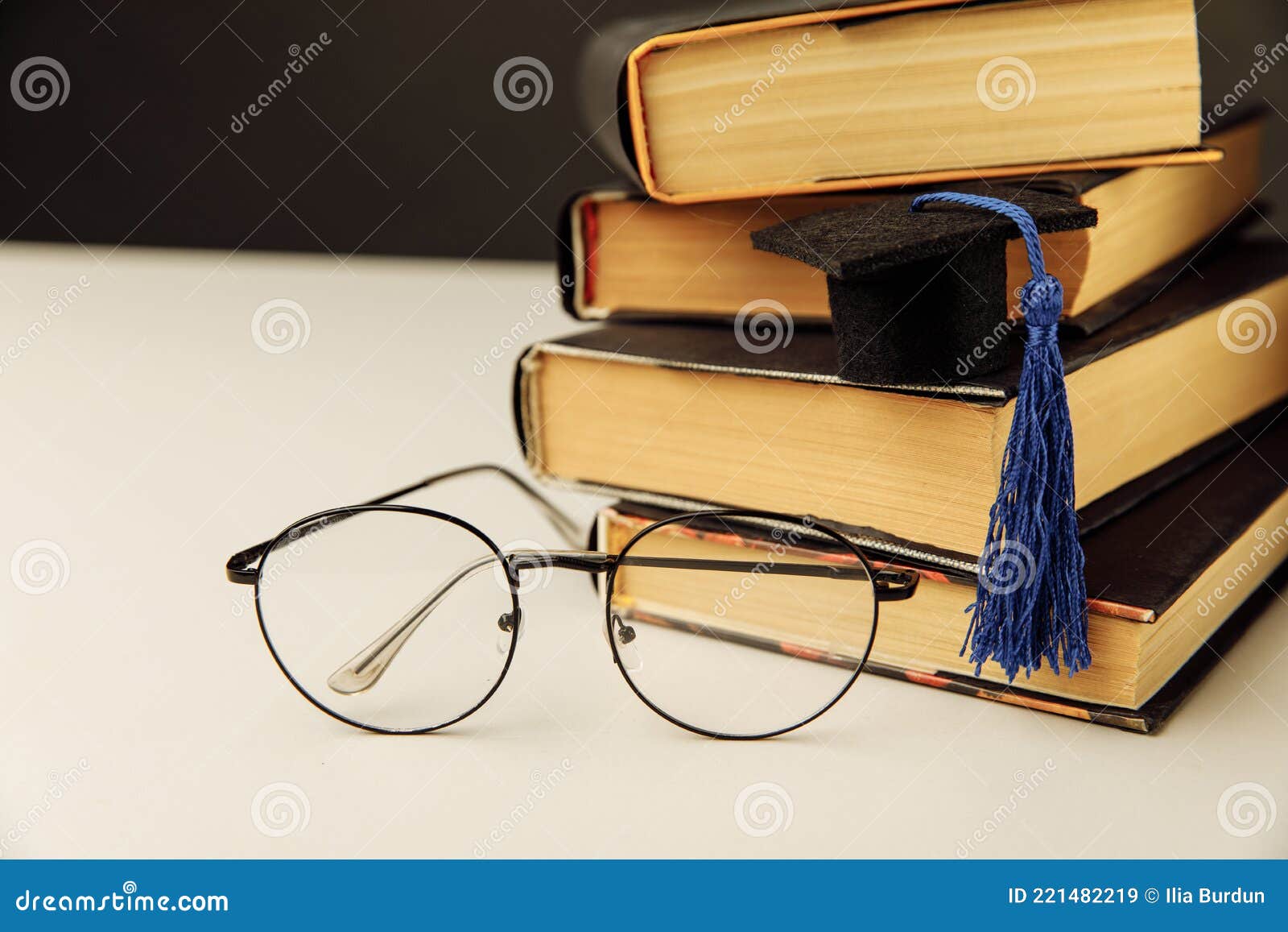 Graduation Cap on a Table. Graduation Concept Stock Image - Image of ...