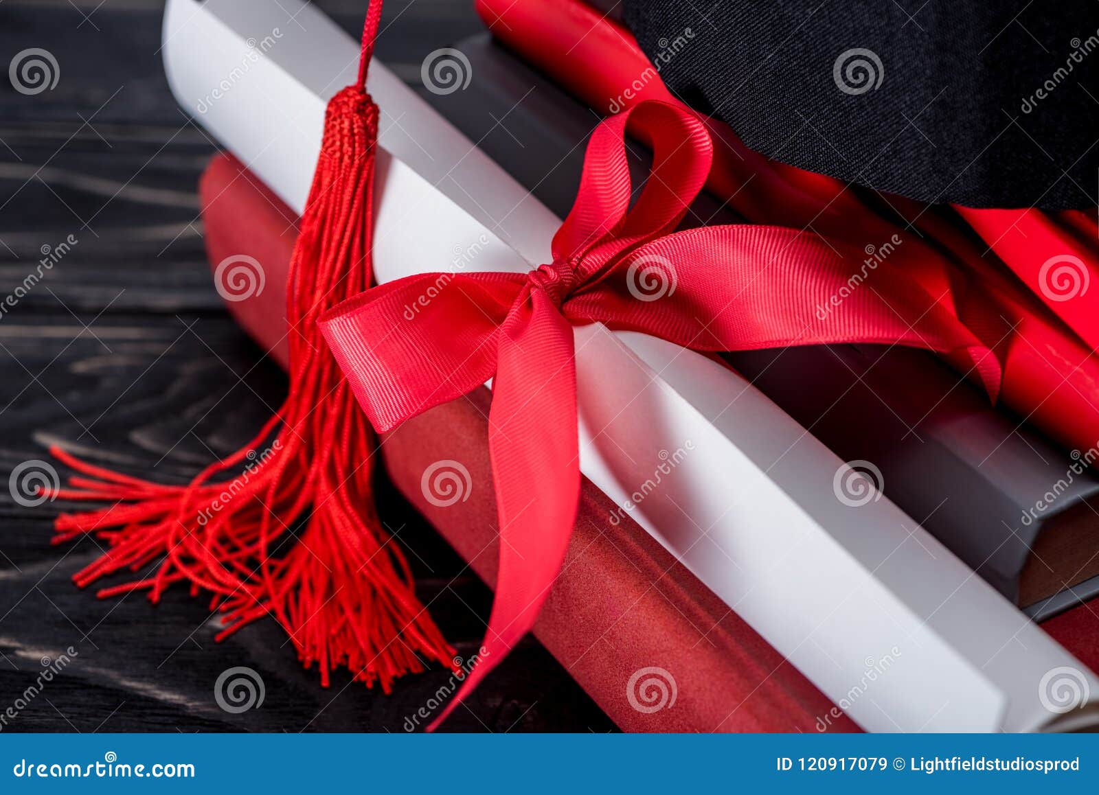 Graduation Hat and Diploma with Red Ribbon on Stack Stock Image - Image ...