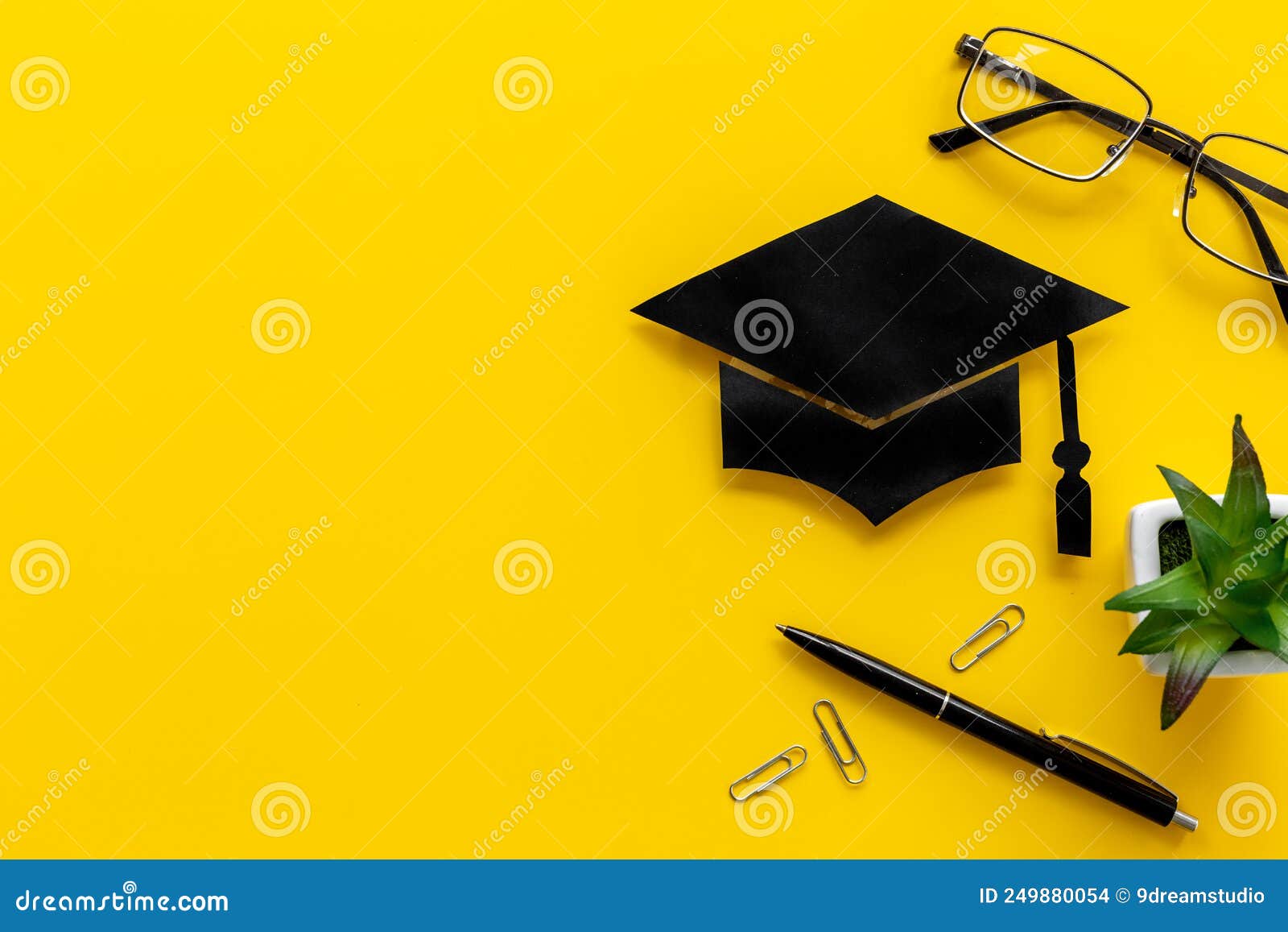 Graduation Hat on Students Table. Masters or Bachelors Degree Concept ...
