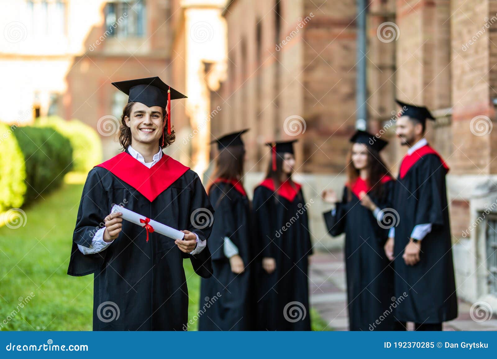 Graduation Man in Front of a Group of Graduation Students at University ...