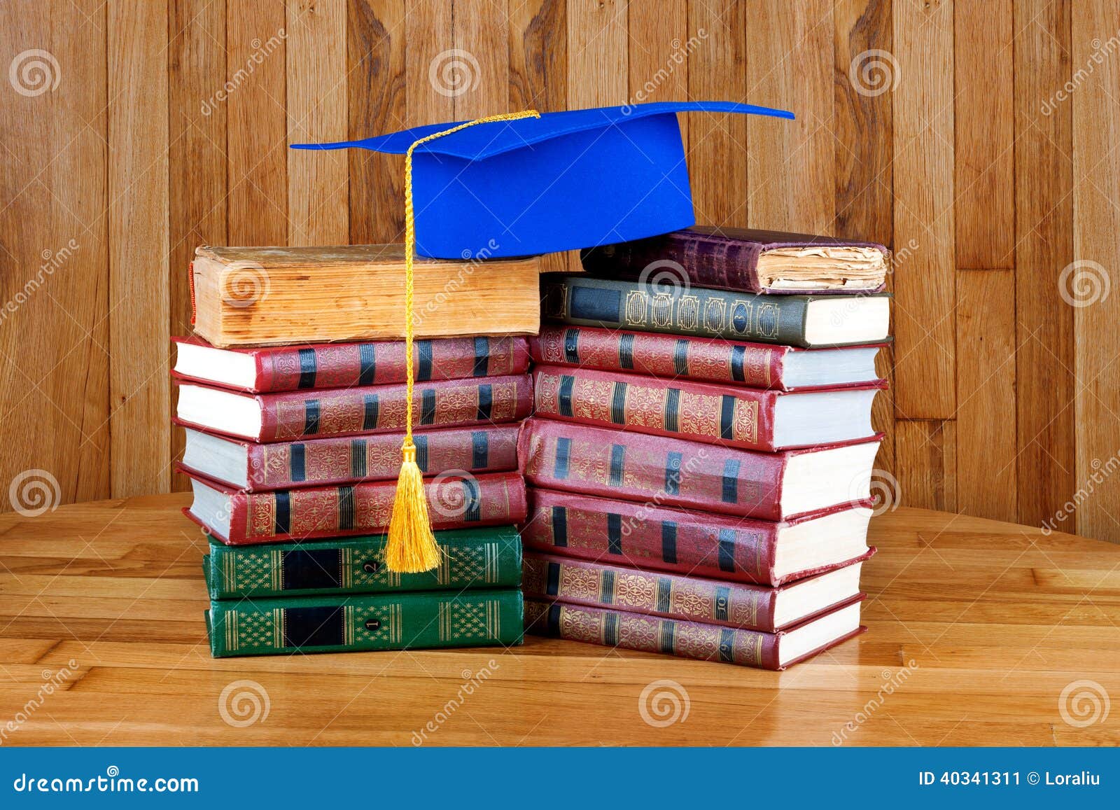 Graduation Mortarboard on Top of Stack of Books Stock Image - Image of ...