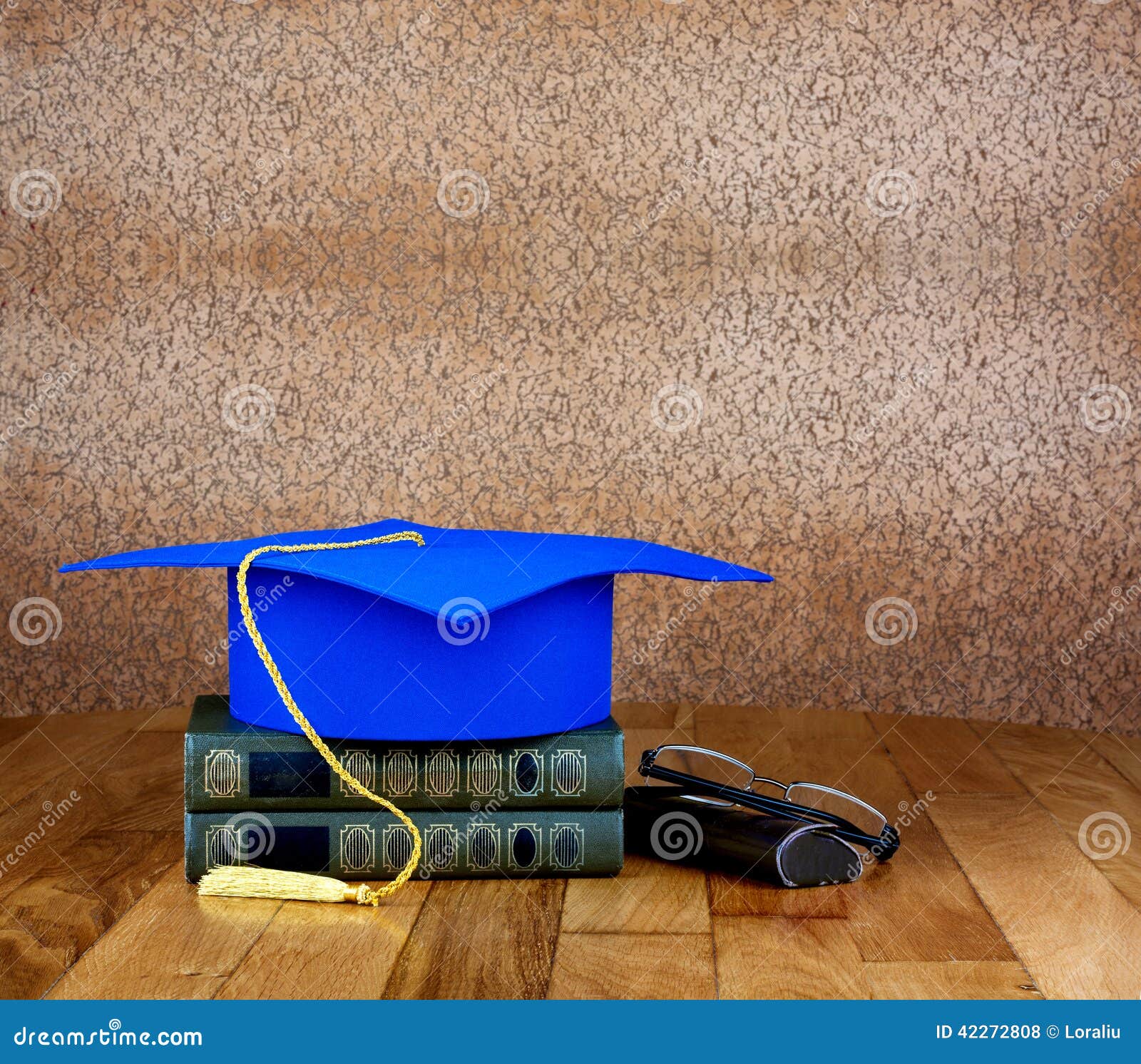 Graduation Mortarboard on Top of Stack of Books Stock Photo - Image of ...