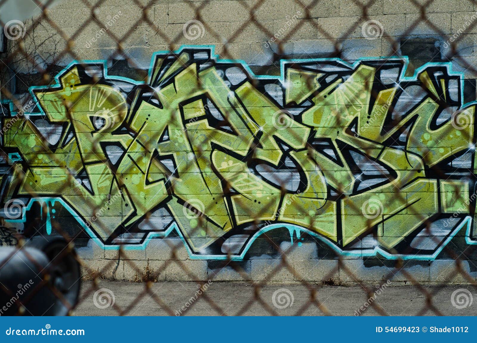 Graffiti art through fence editorial stock photo. Image of spraypainted ...