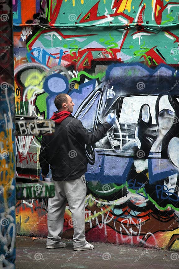 Graffiti artist at work editorial stock image. Image of crime - 28241539