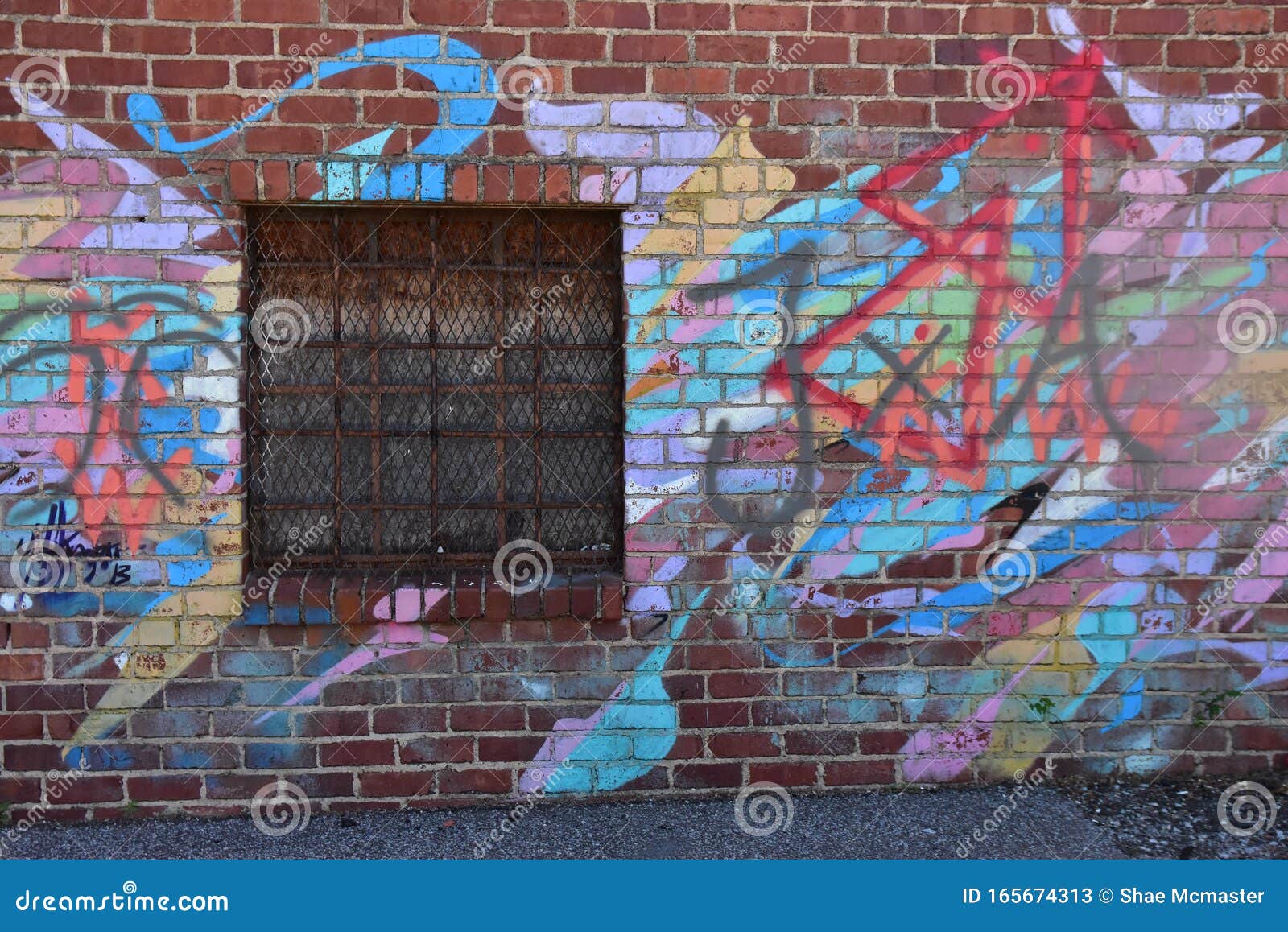 Graffiti on brick building stock image. Image of city - 165674313