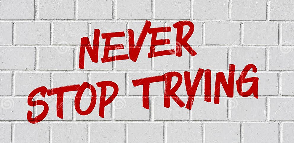 Graffiti on a Brick Wall - Never Stop Trying Stock Image - Image of ...