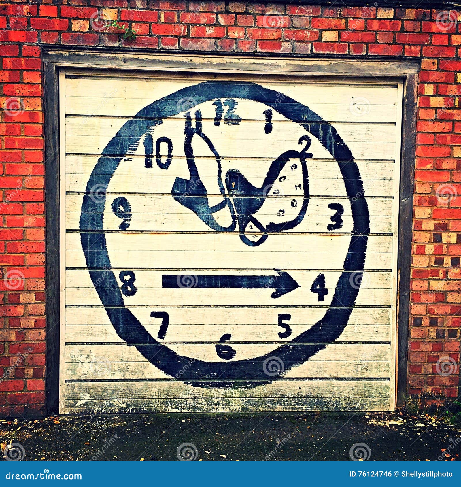 Graffiti Clock Time and Boot Shoes on Garage Door Editorial Photo ...