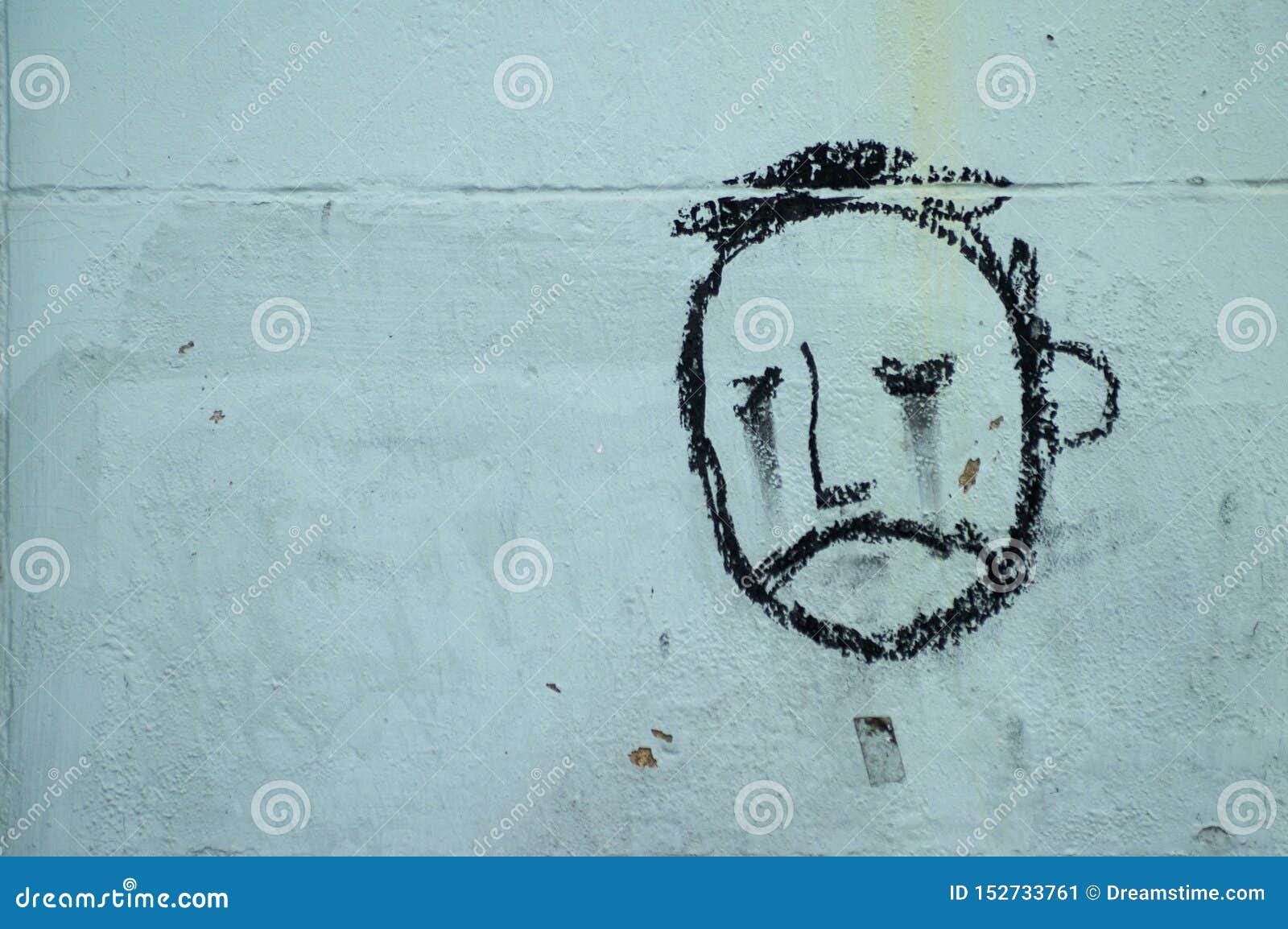 Graffiti, Face of a Sad Looking Man on a Wall Editorial Photo - Image ...