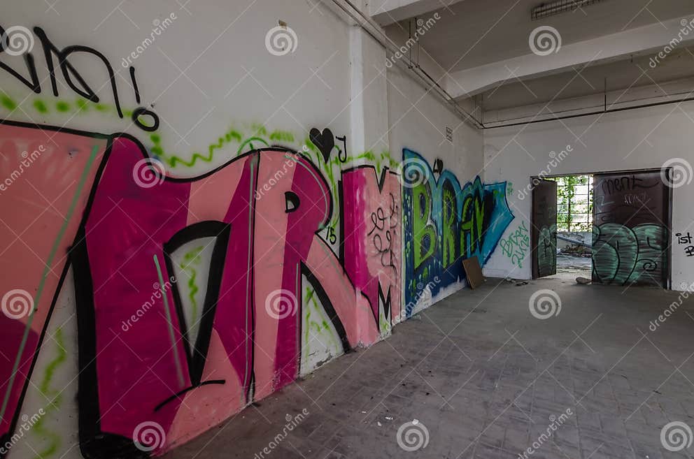 Graffiti in an factory editorial photography. Image of overgrown ...