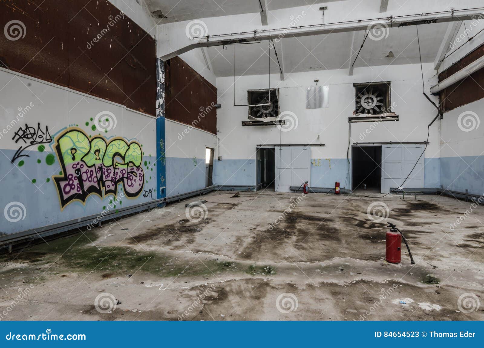 Graffiti in factory hall editorial stock photo. Image of facility ...