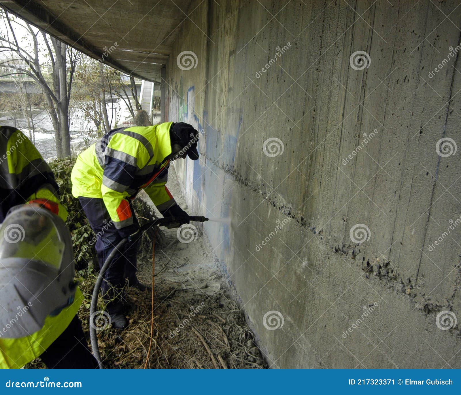 Graffiti removal on a wall editorial photo. Image of professionals ...