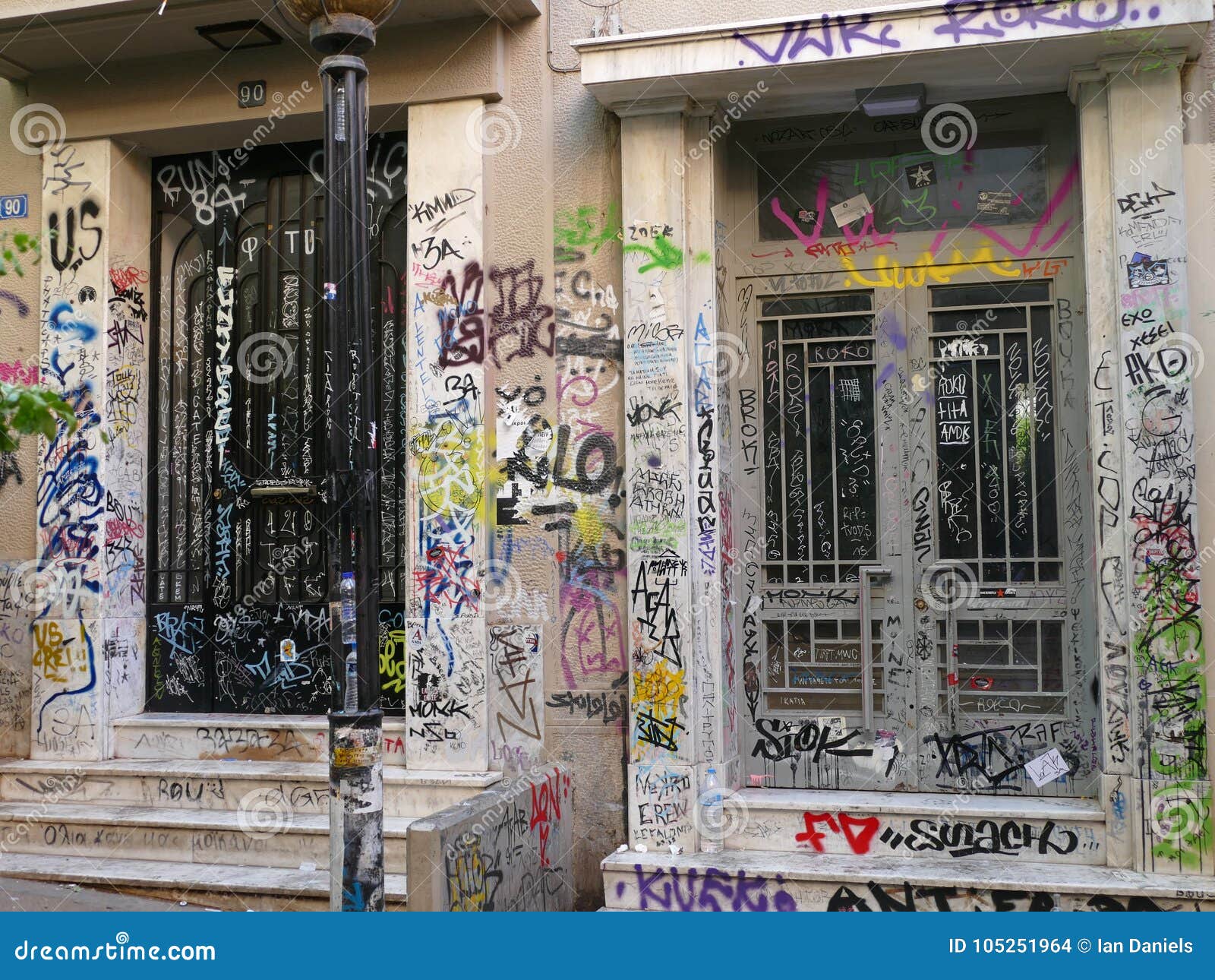 Graffiti Scribbled Across Two Doors in Athens, Greece Editorial Stock ...