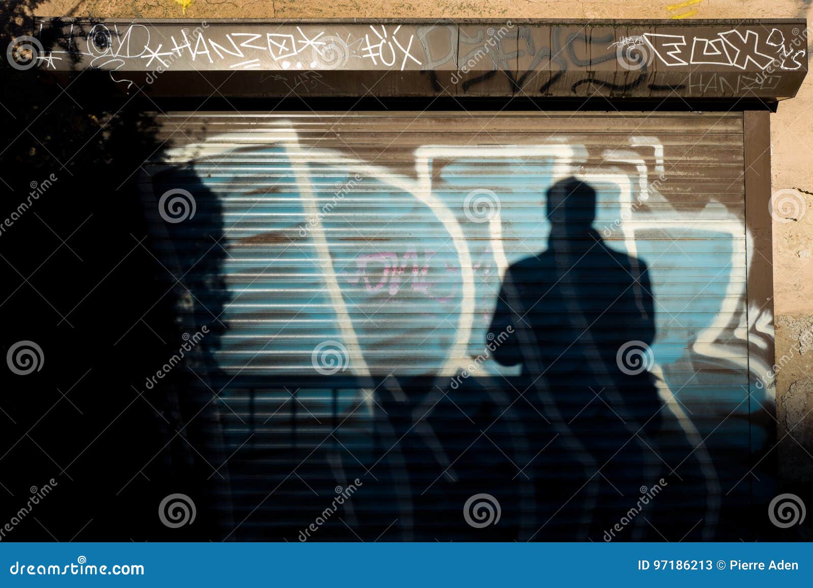 Graffiti and shadow of man stock image. Image of profile - 97186213