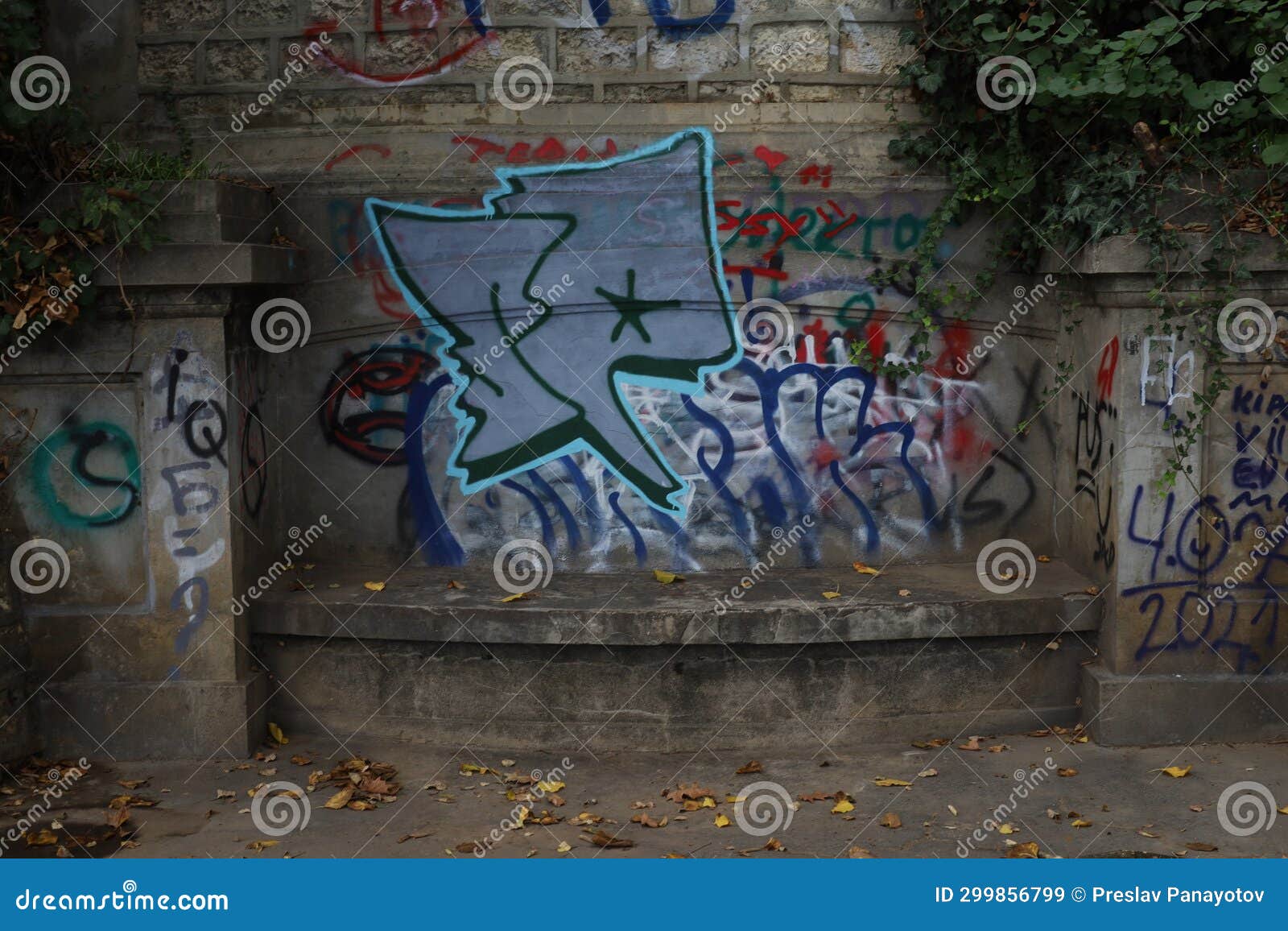 Graffiti on a stone wall stock image. Image of vandal - 299856799