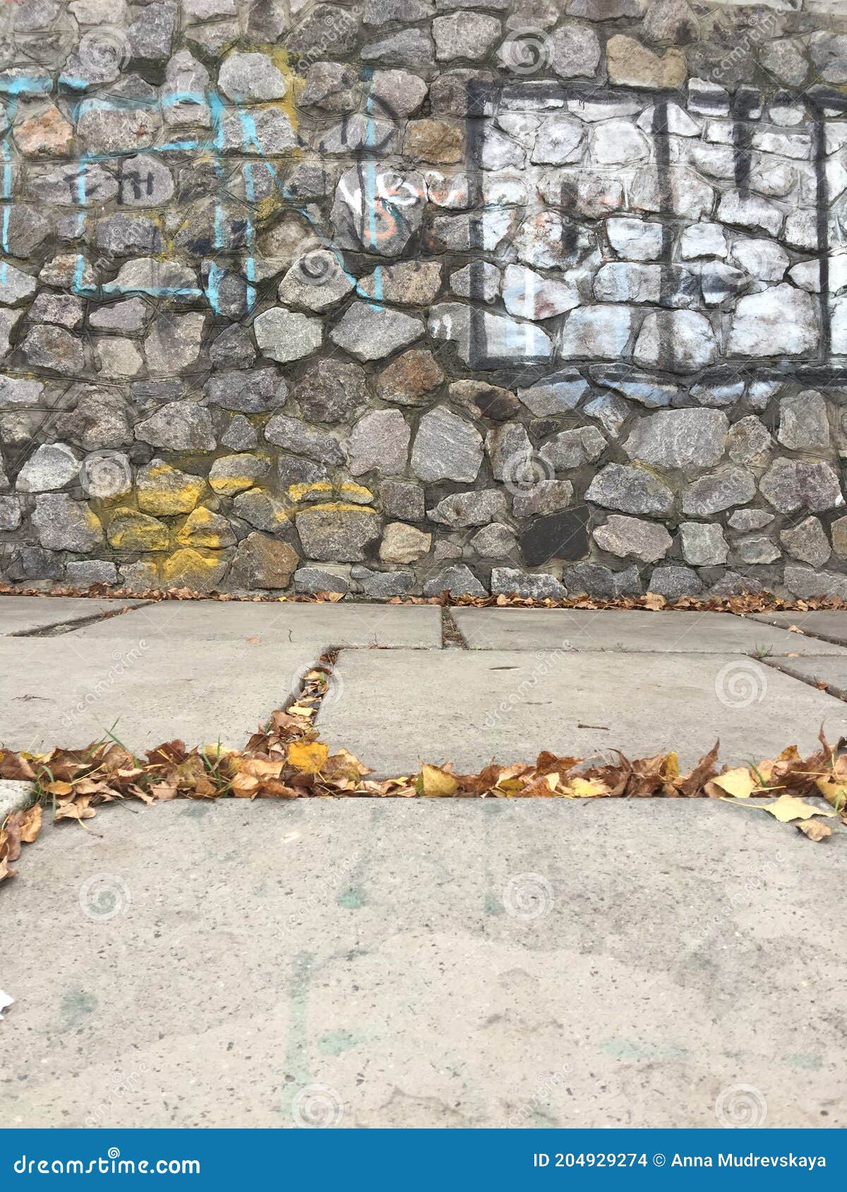Graffiti Stone Wall and Sidewalk Tiles. Stock Photo - Image of stone ...
