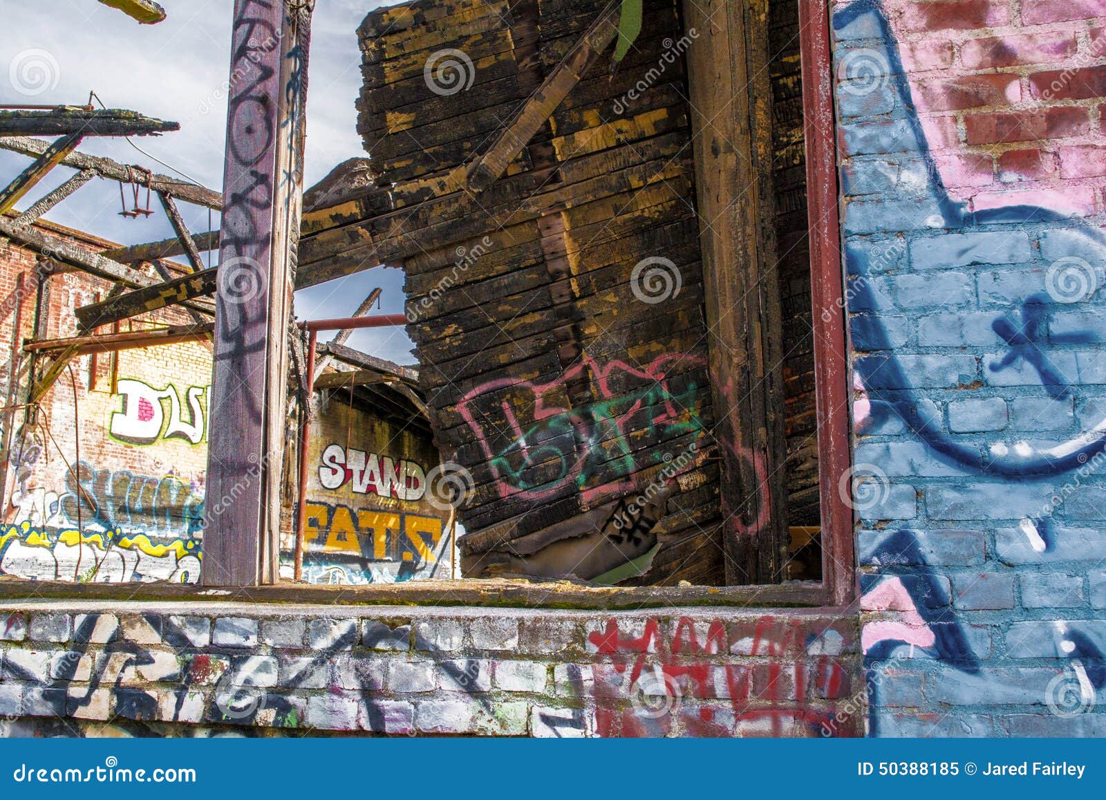 Graffiti On A Window In The City. Blury Buildings At The Background ...