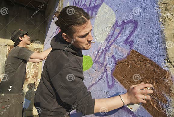 GRAFFITI WRITERS editorial stock photo. Image of wall - 8850048
