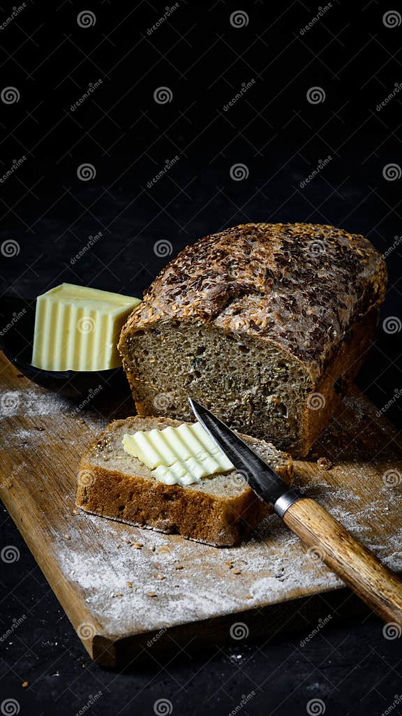 Grain Bread with Butter on a Cutting Board. Stock Image - Image of cutting, homemade: 309399745