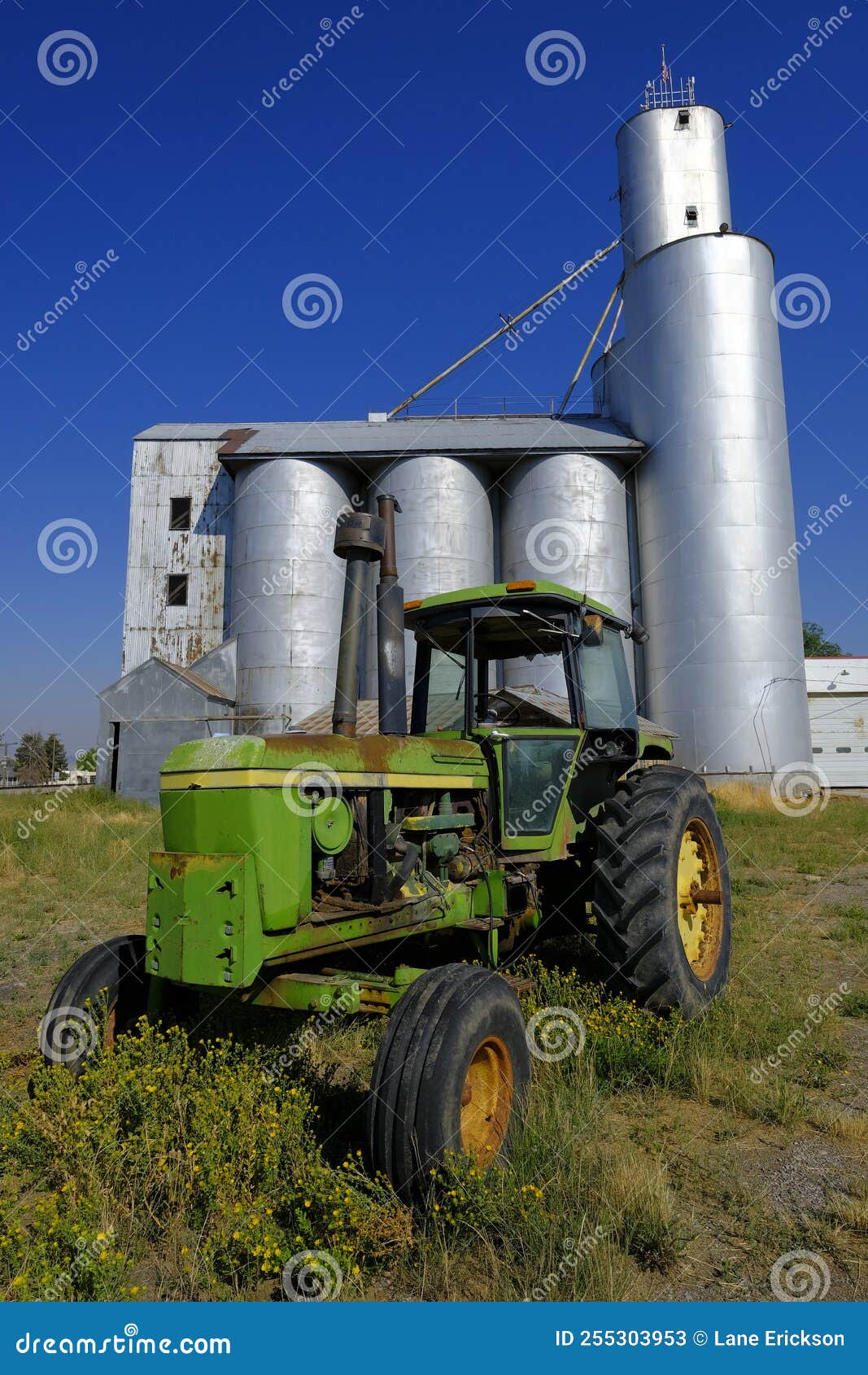 Grain Elevator Silo with Old Green Tractor Stock Image - Image of ...