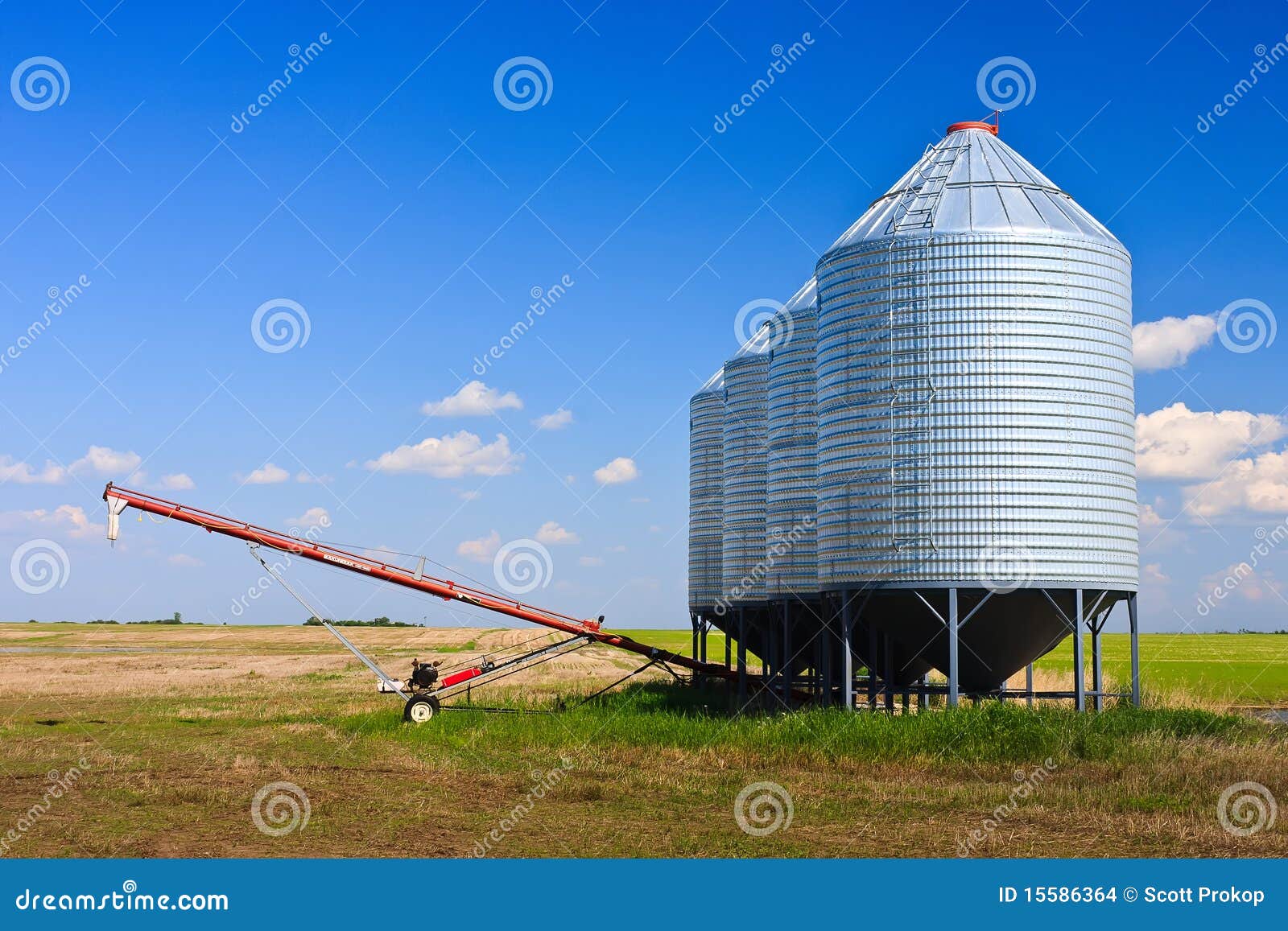 Grain Silos and Auger stock photo. Image of blue, container - 15586364