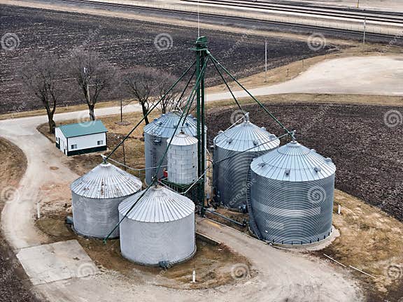 Grain Storage Bins from the Air with Farm Fields in the Background ...