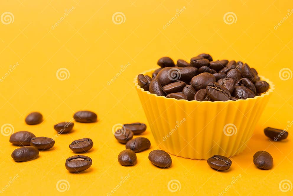 Grains of Coffee in a Yellow Container on a Yellow Background, a Number ...
