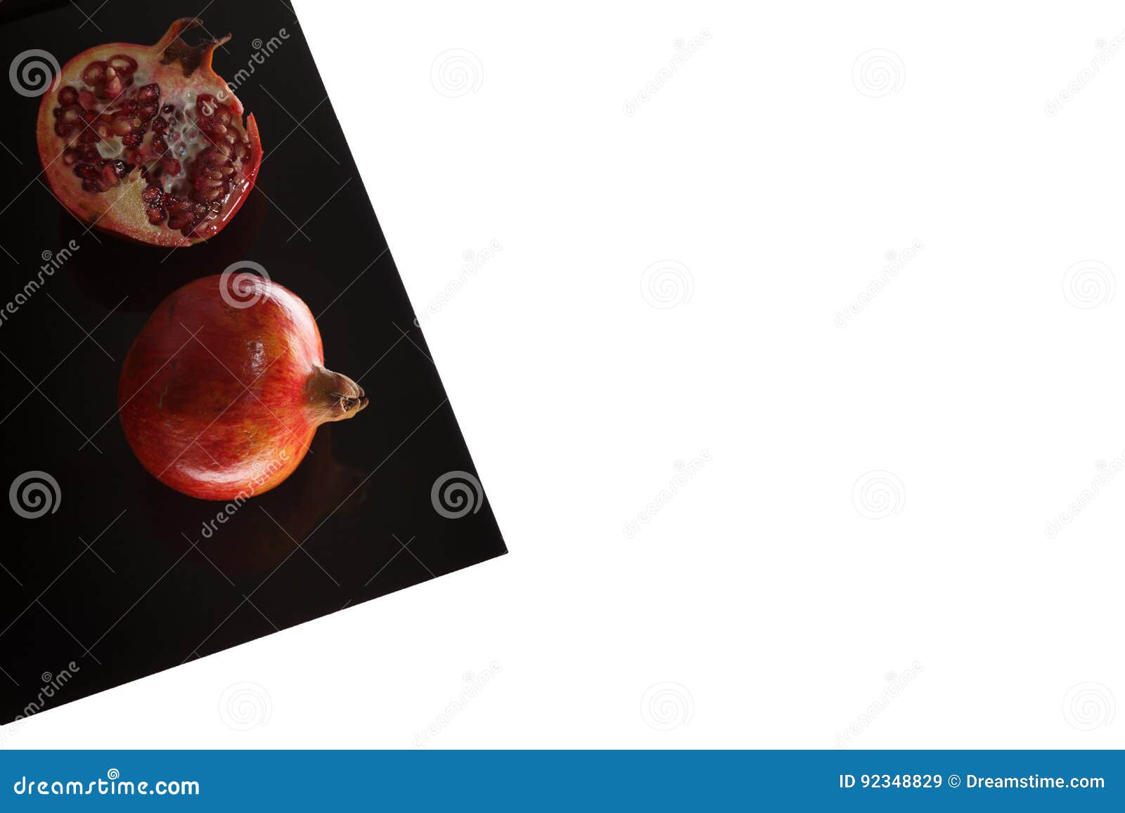 Granat Apple on Black Sheet Isolated on White Stock Image - Image of ...