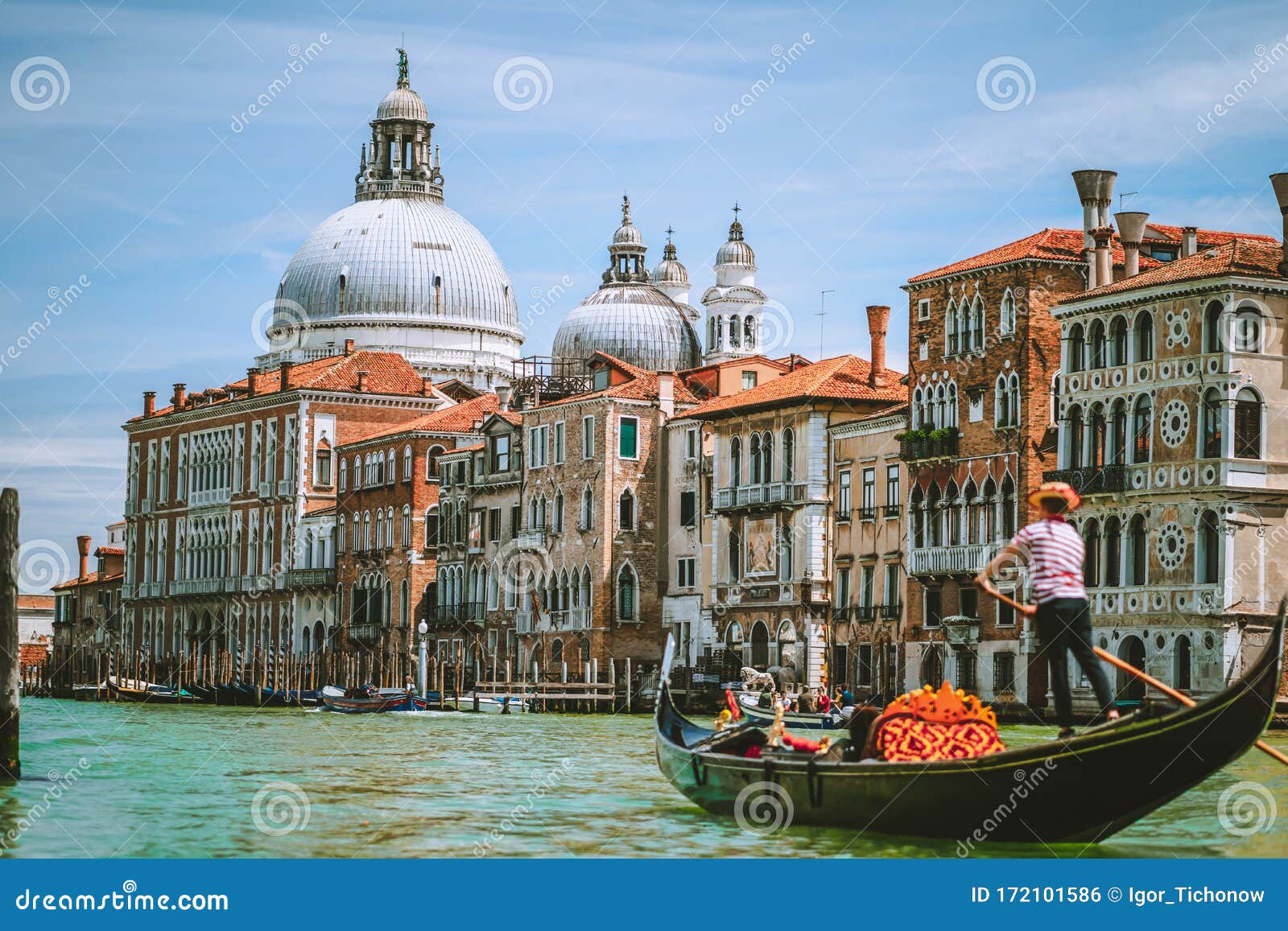 Grand Canal Traditional Gondola And Basilica Santa Maria Della Salute