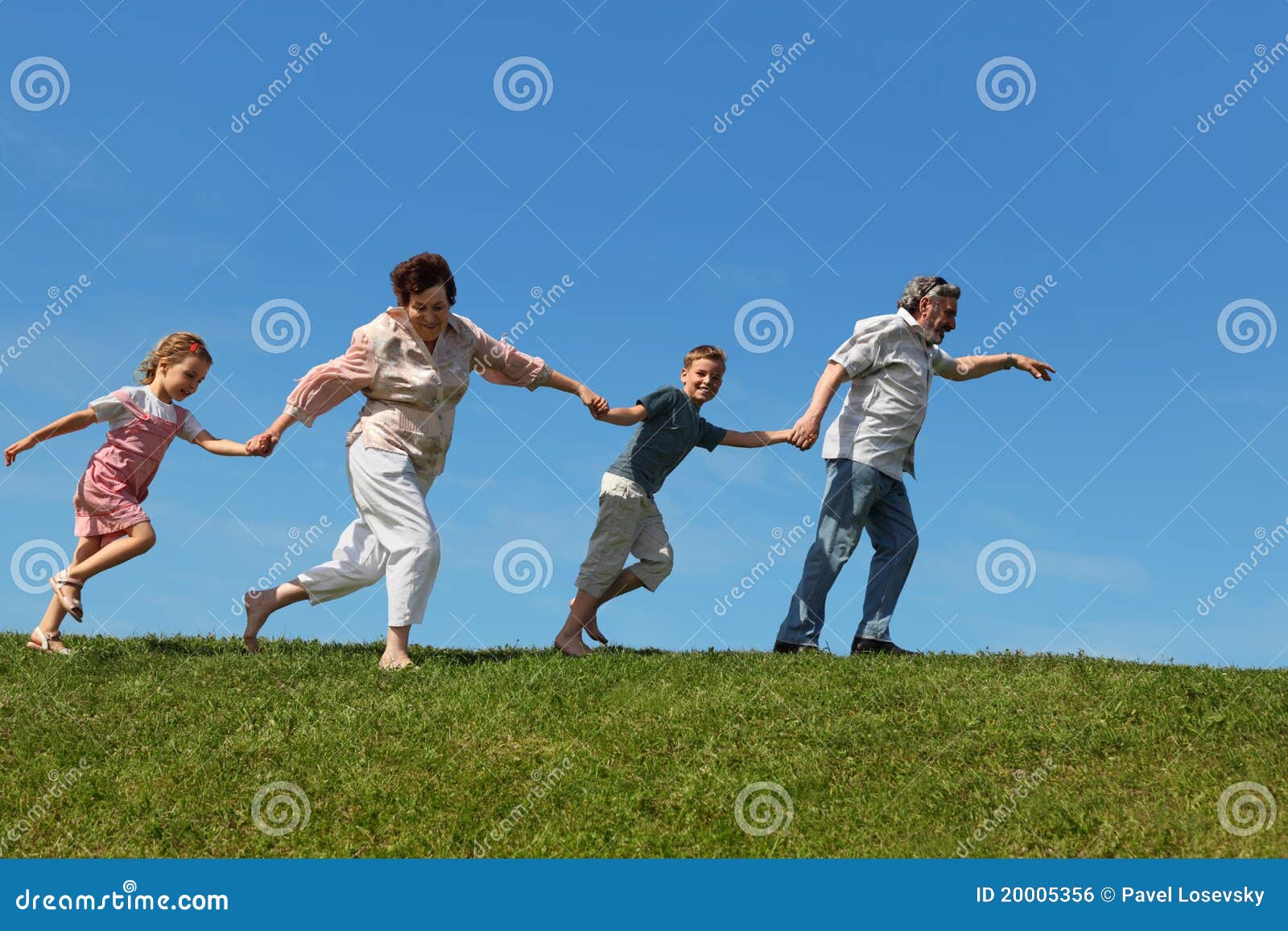 Grandchildren and Grandparents Running on Lawn Stock Photo - Image of ...