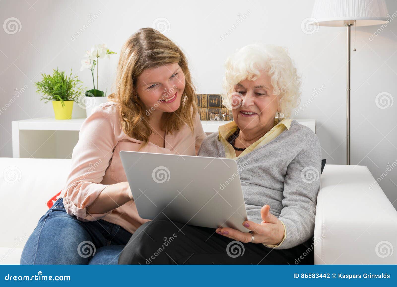 Granddaughter Teaching Grandma How To Use Tablet Computer Royalty-Free ...