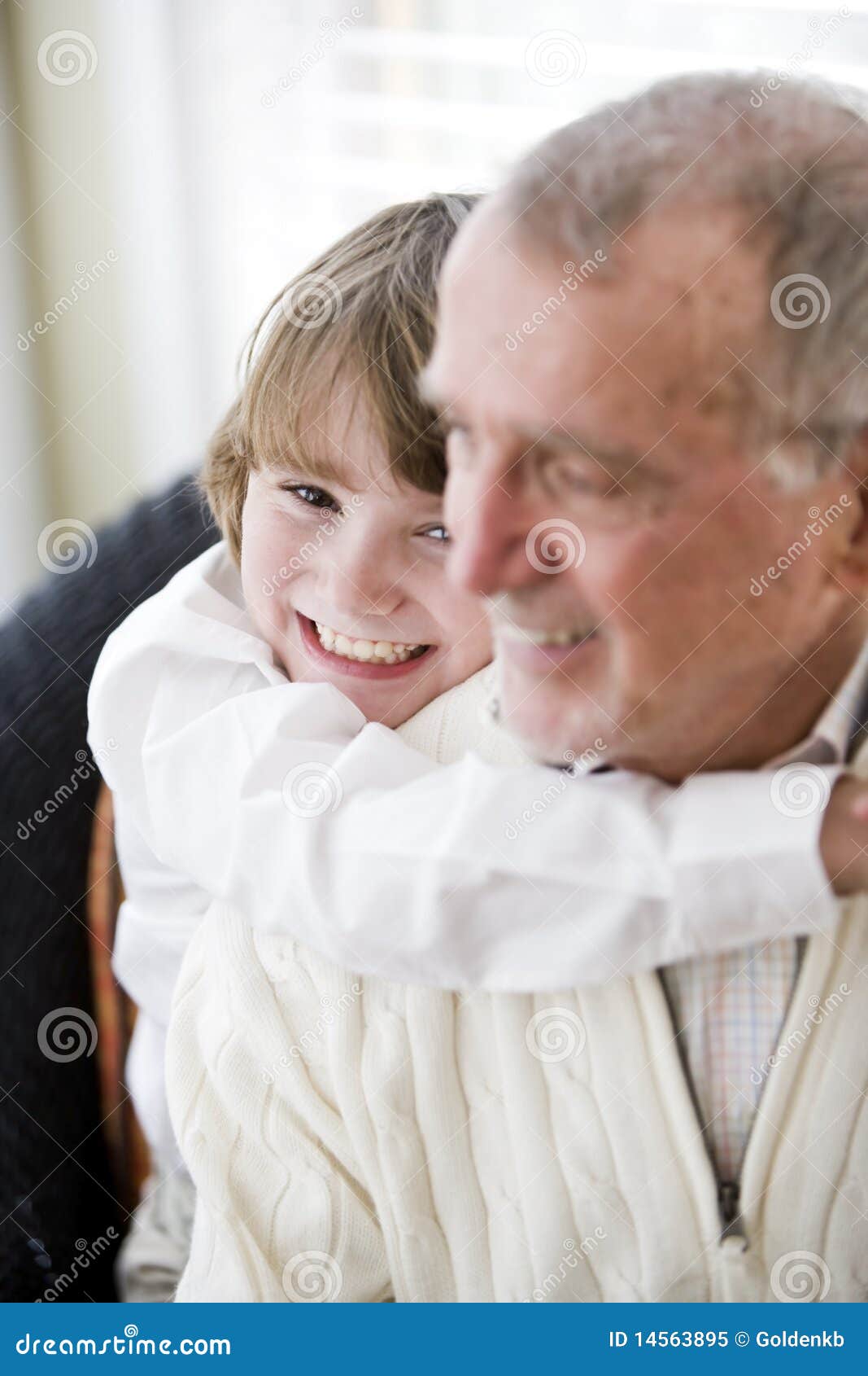 Grandfather Getting Hug from Grandson Stock Image - Image of hugging ...