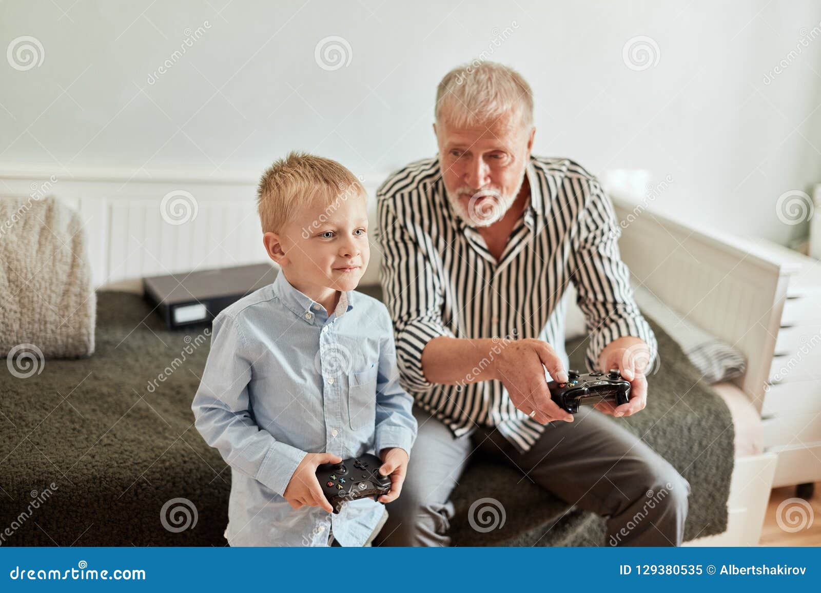Grandfather and Grandson Playing Video Games on Computer with Joystick ...