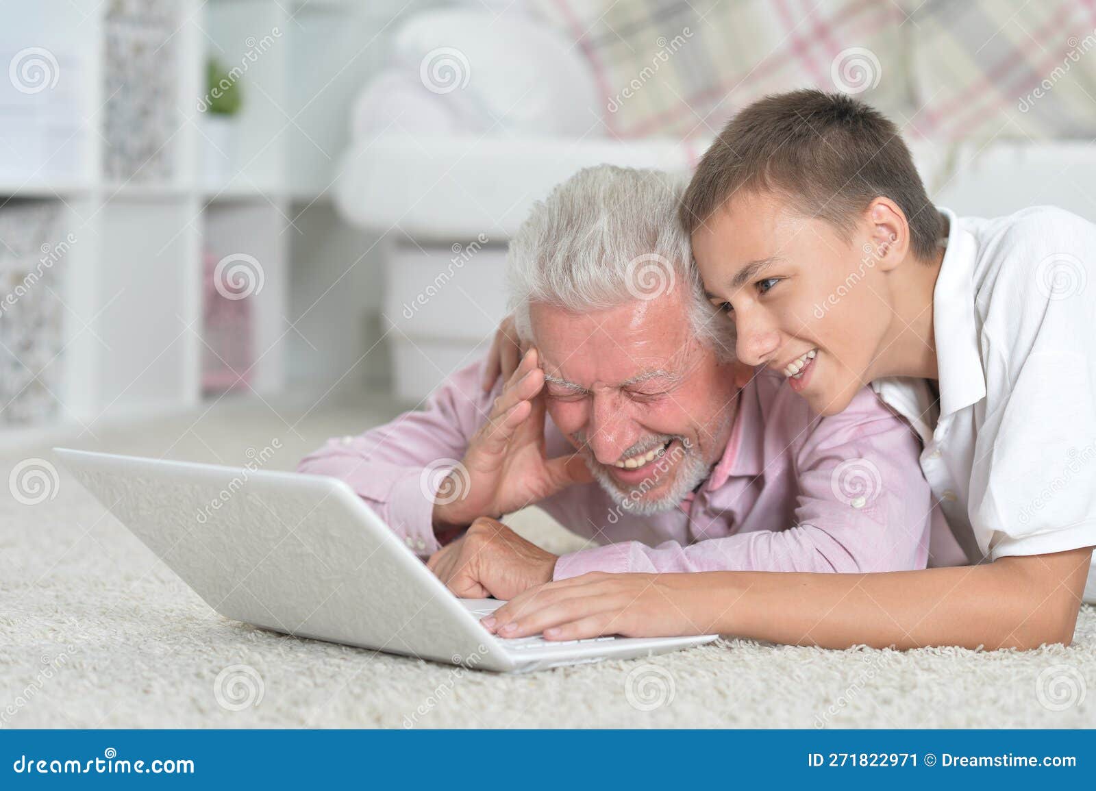 Grandfather with Grandson Using Laptop while Lying on Floor Stock Image ...