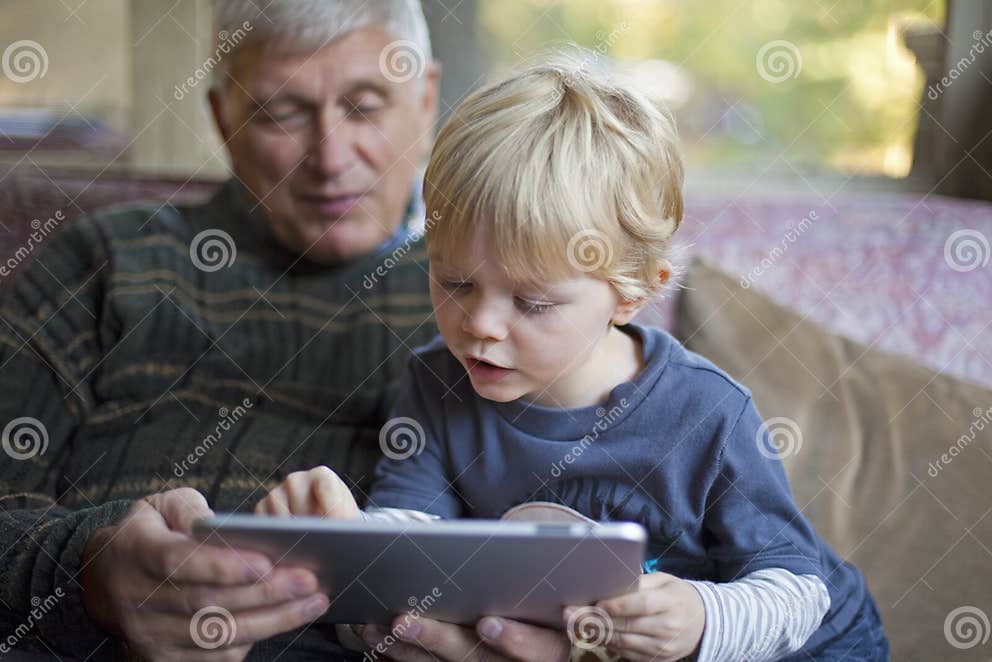 Grandfather and Grandson Using Tablet PC Stock Image - Image of people ...
