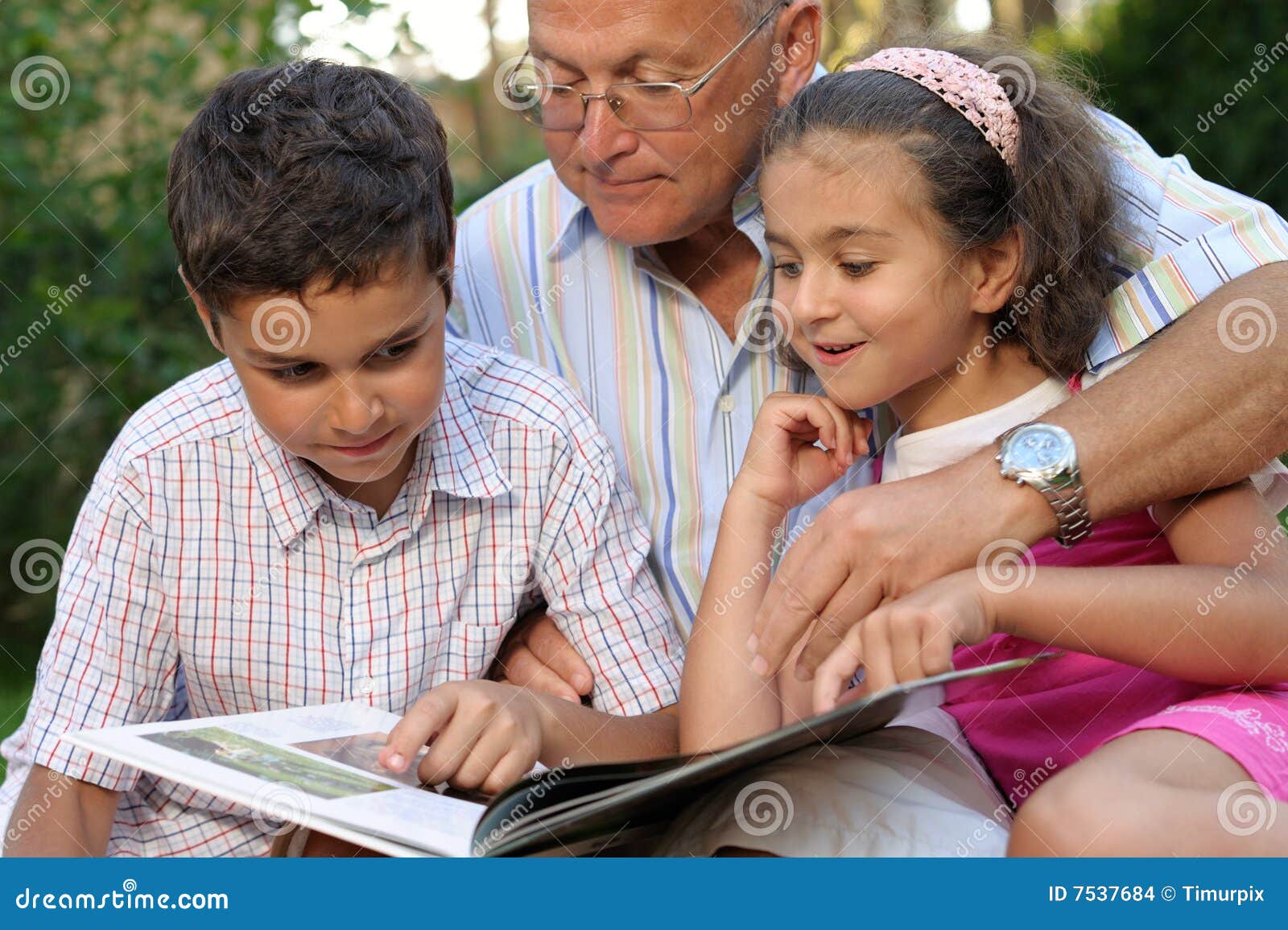 Grandfather and Kids Reading Book Stock Photo - Image of mature, park ...