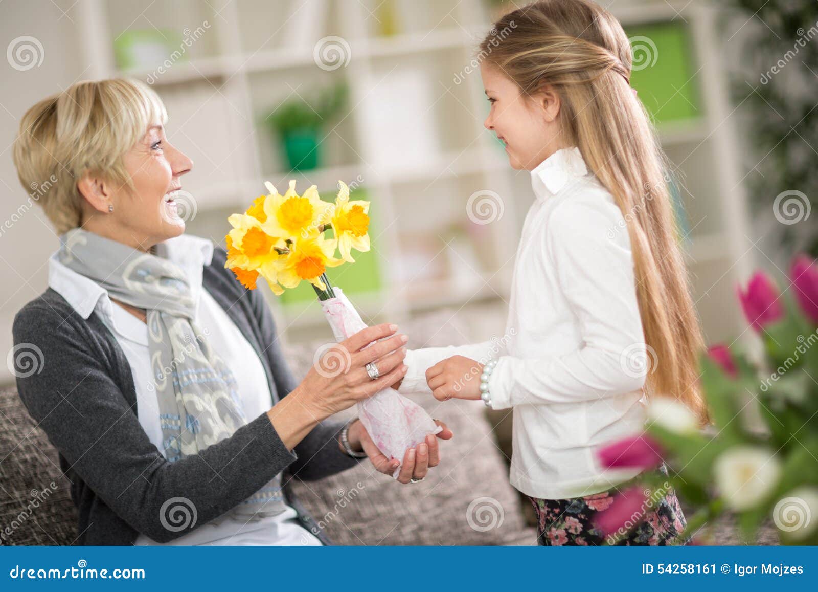Grandmother With A Bouquet Of Flowers Received From Granddaughter Stock