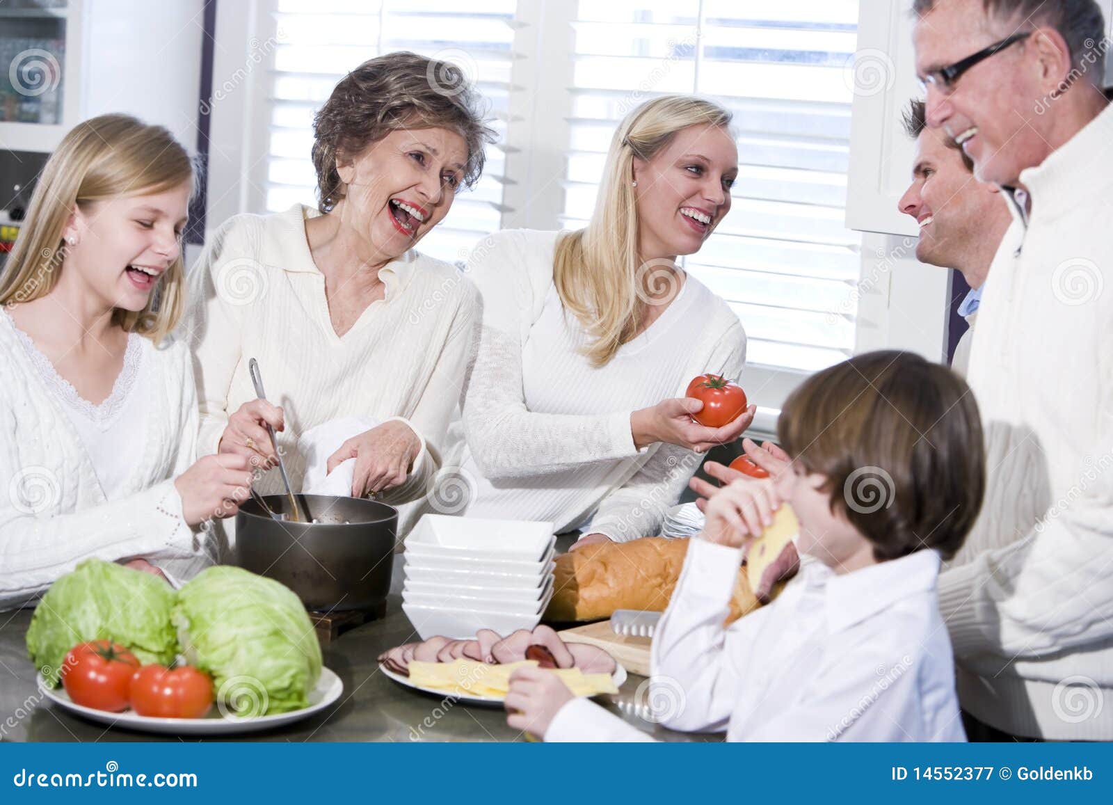 Grandmother with Family Laughing in Kitchen Stock Image - Image of ...