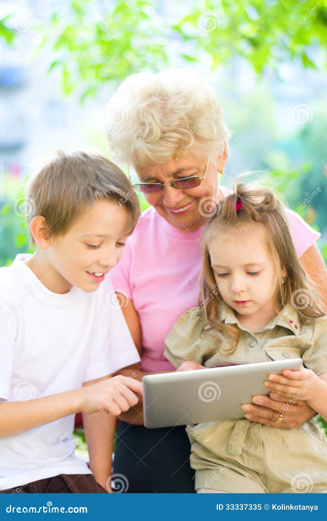 Grandmother with Grandchildren Using Tablet Stock Image - Image of kids ...