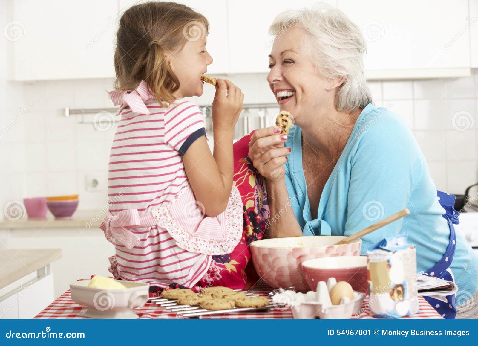 Grandmother and Granddaughter Baking in Kitchen Stock Image - Image of ...