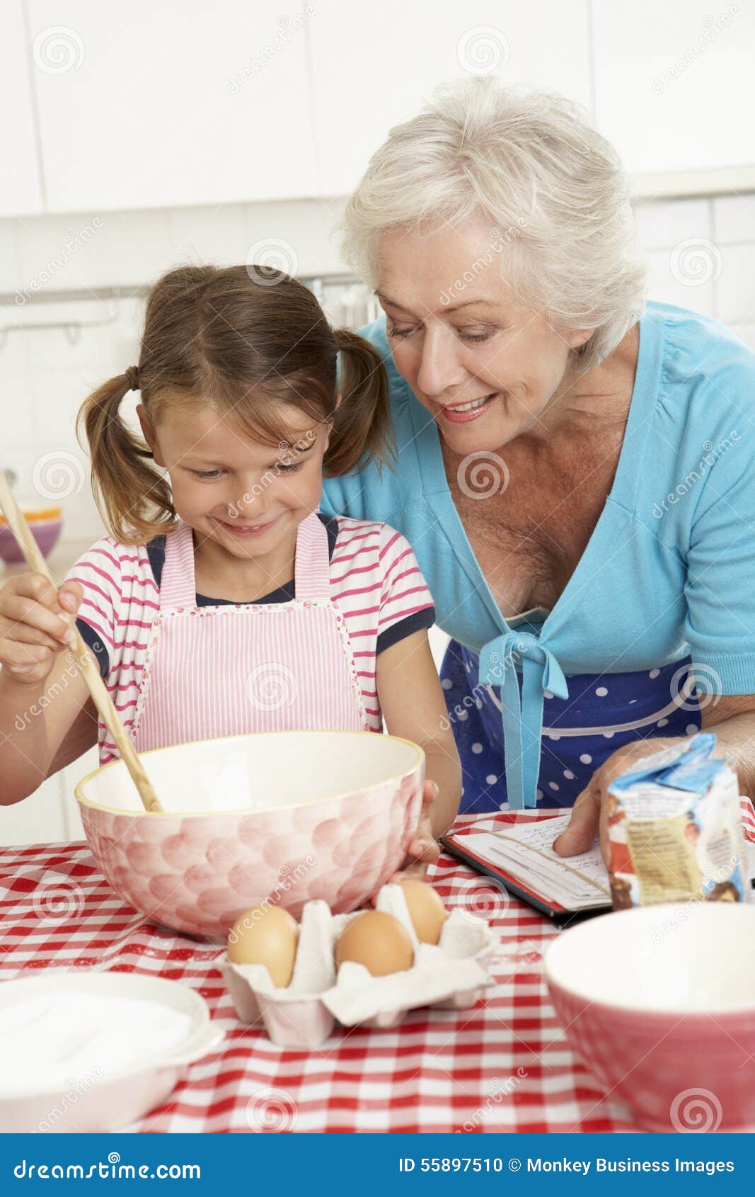 Grandmother and Granddaughter Baking in Kitchen Stock Photo - Image of ...