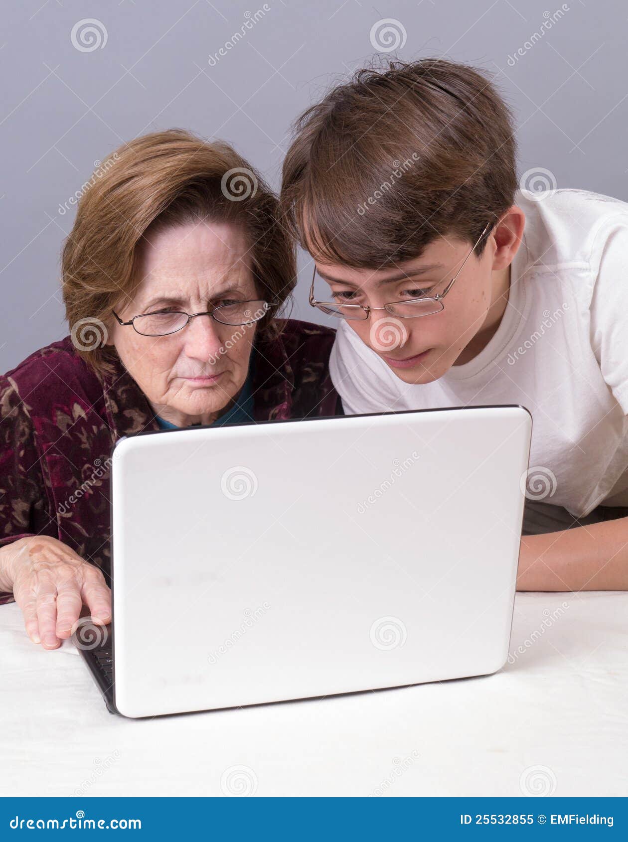 Grandmother At The Computer, An Old Woman In Headphones Looks At The ...