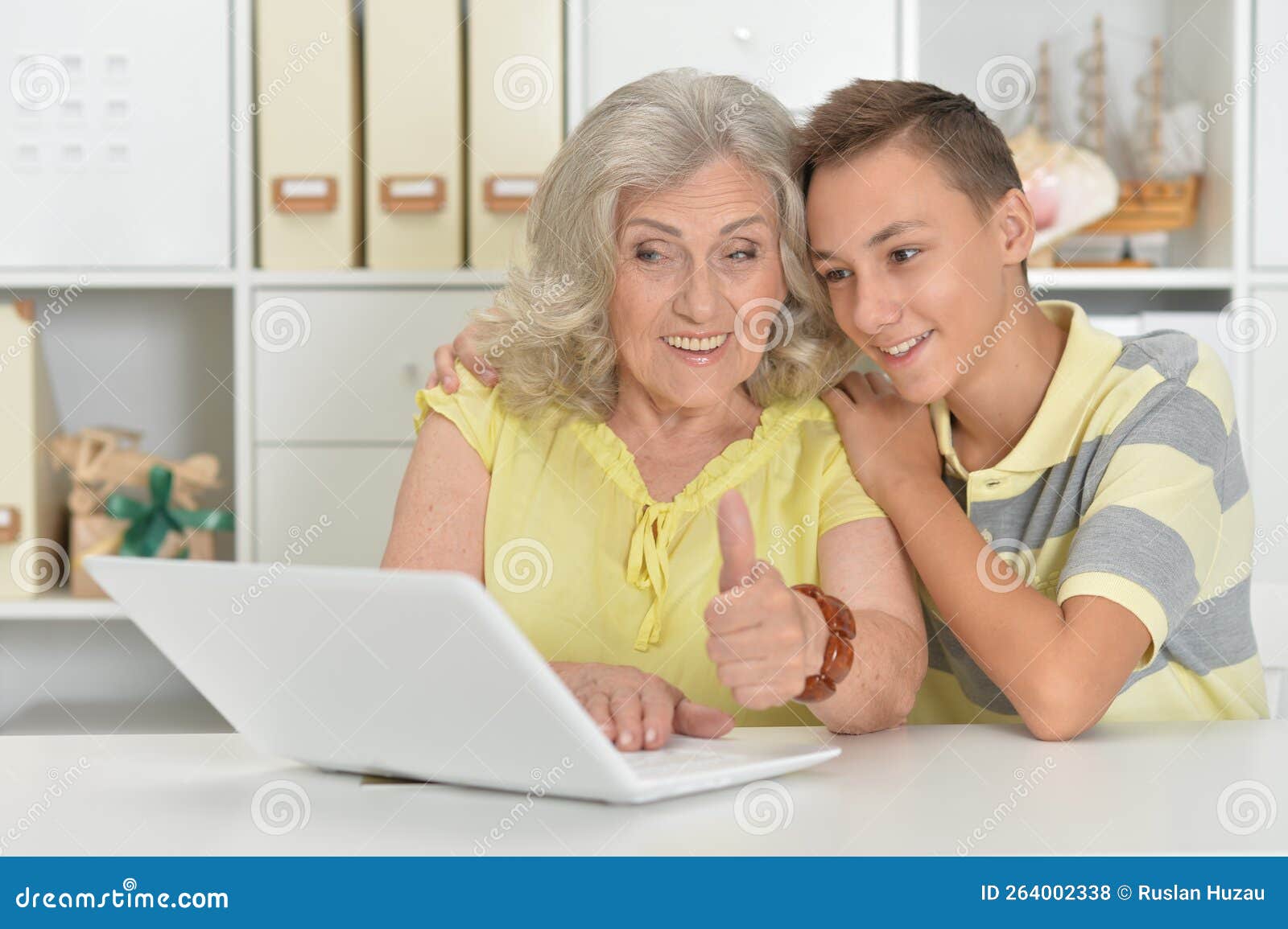 Grandmother with Grandson Using Laptop at Home Stock Photo - Image of ...