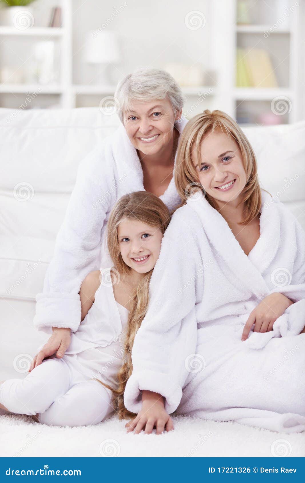 Grandmother With Mother And Adult Daughter Relaxing On Sofa Royalty