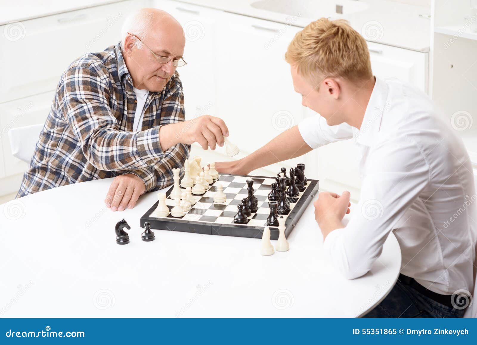 Grandson and Grandfather Playing Chess in Kitchen Stock Image - Image ...