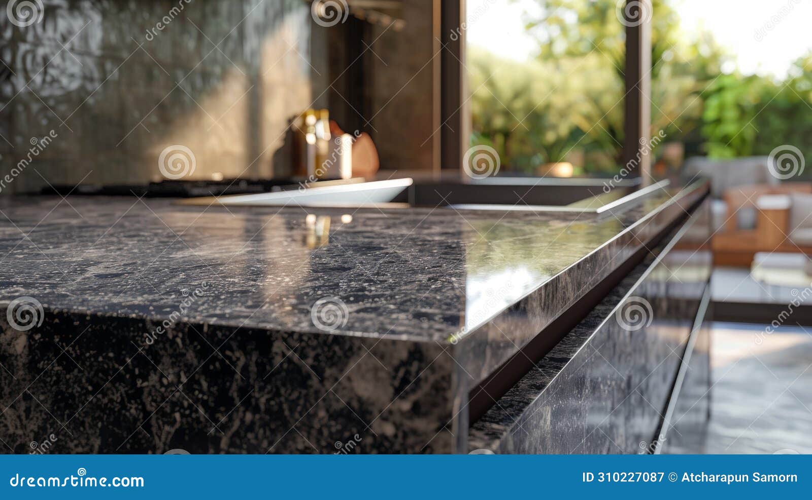 A Granite Kitchen with a Countertop that Has a Reflection of a Sink ...
