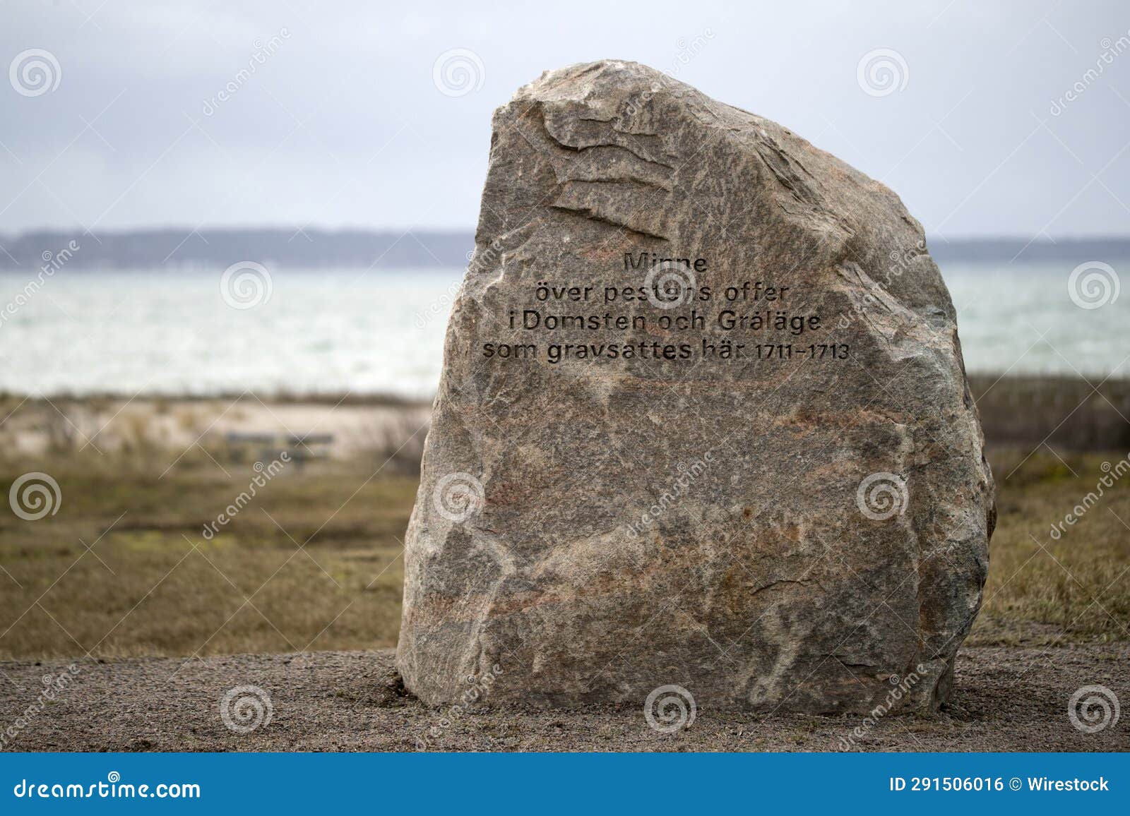 Granite Memorial Stone with a Plaque in Larod Against a Clear Blue Sky ...