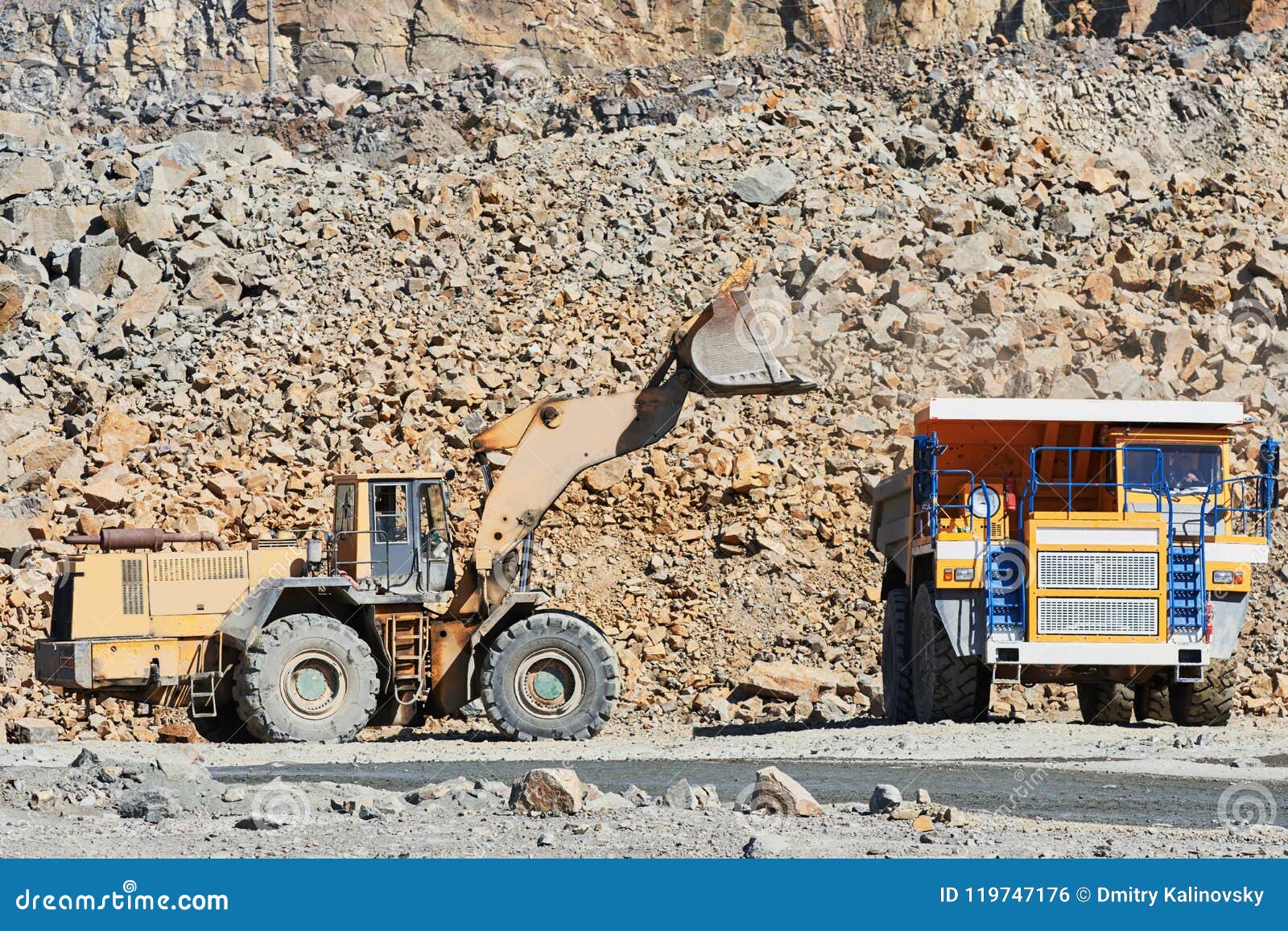 Granite Mining. Wheel Loader Loading Ore into Dump Truck at Opencast ...