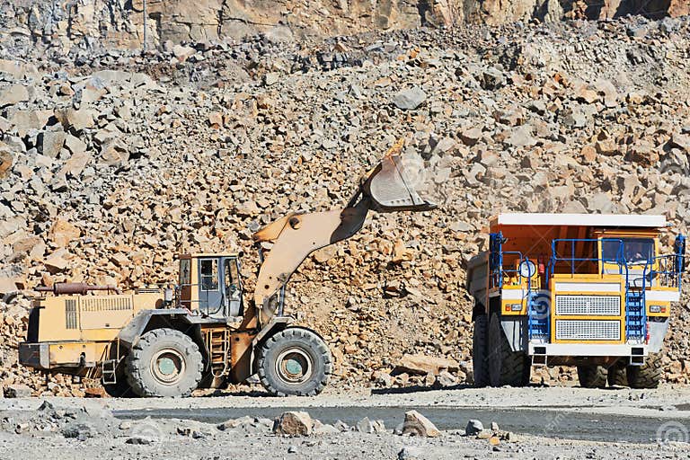 Granite Mining. Wheel Loader Loading Ore into Dump Truck at Opencast ...