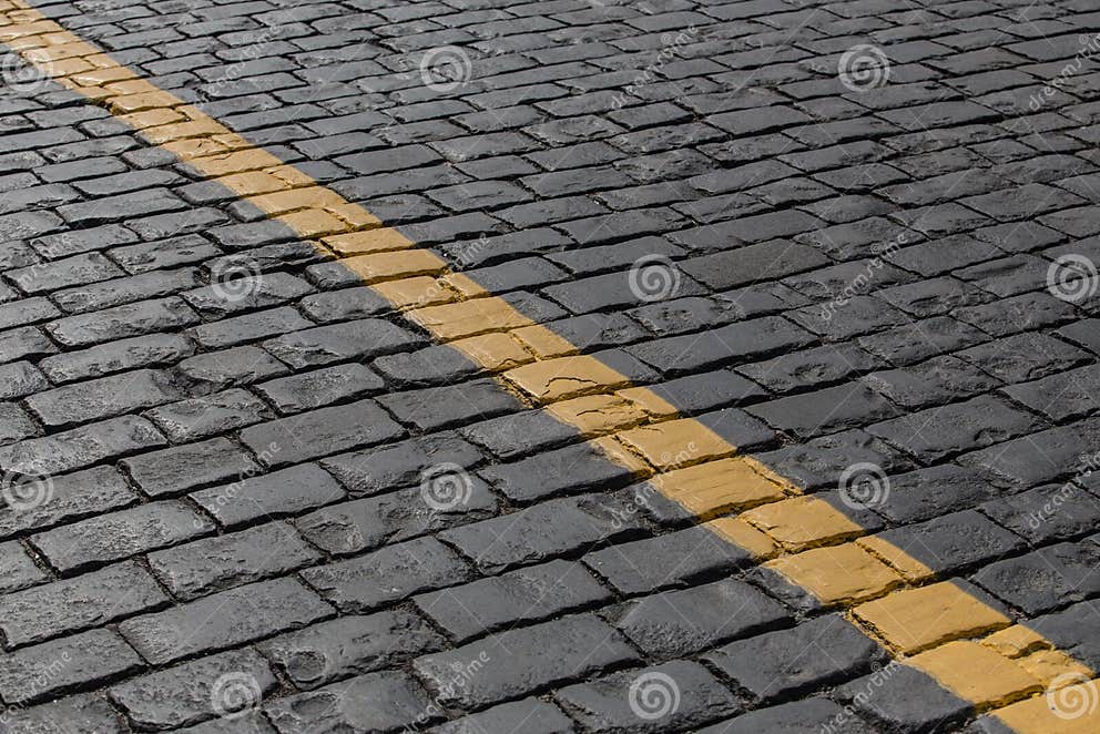 Granite Pavement with a Yellow Stripe on the Diagonal Stock Image ...